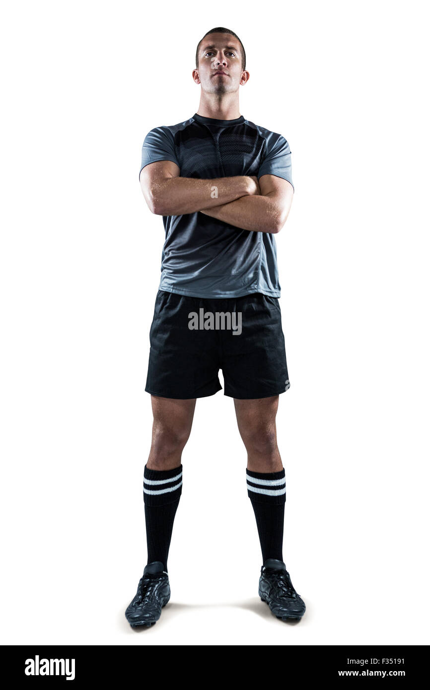 Full length of confident rugby player with arms crossed Stock Photo - Alamy