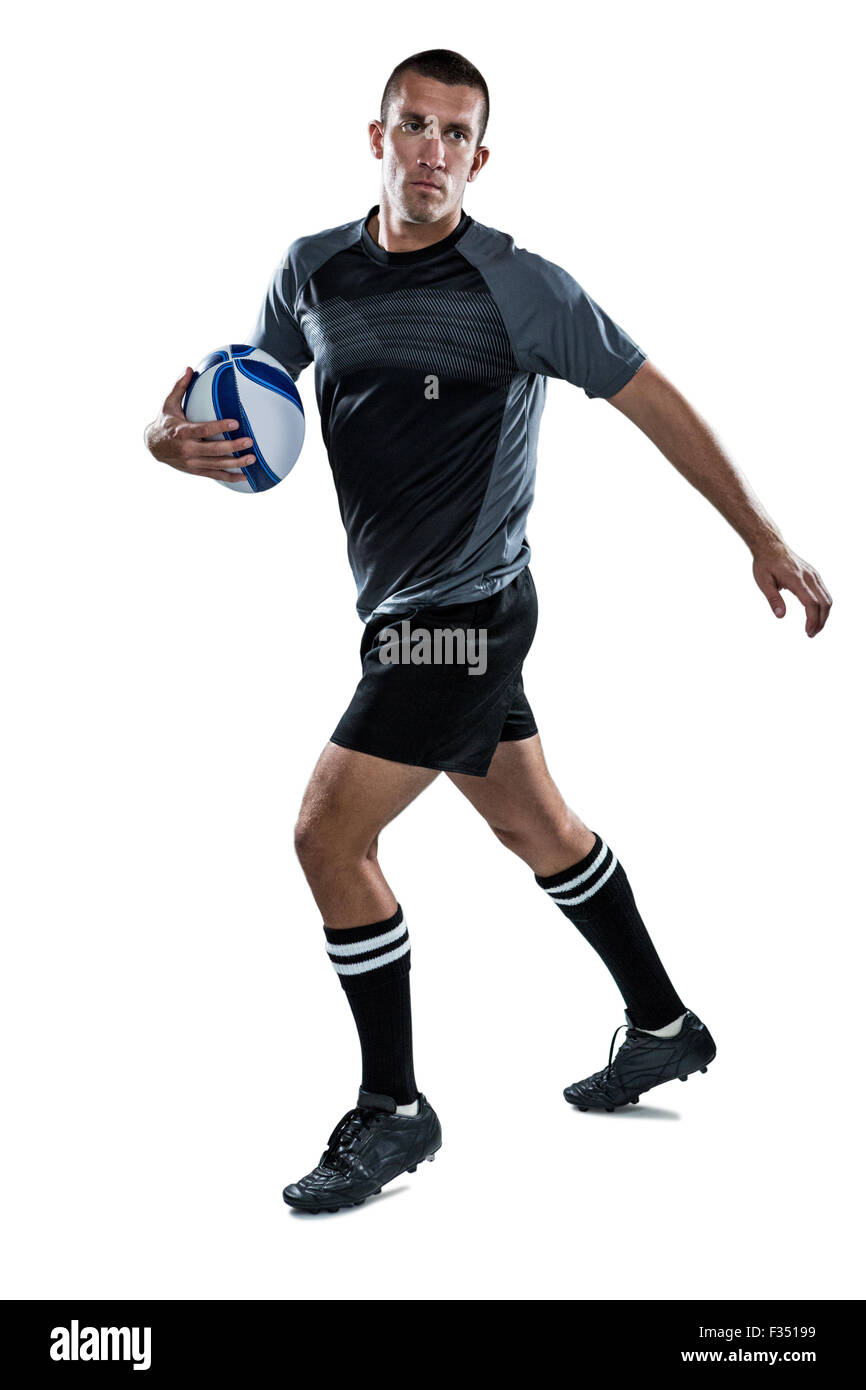 Sportsman running with ball Stock Photo - Alamy