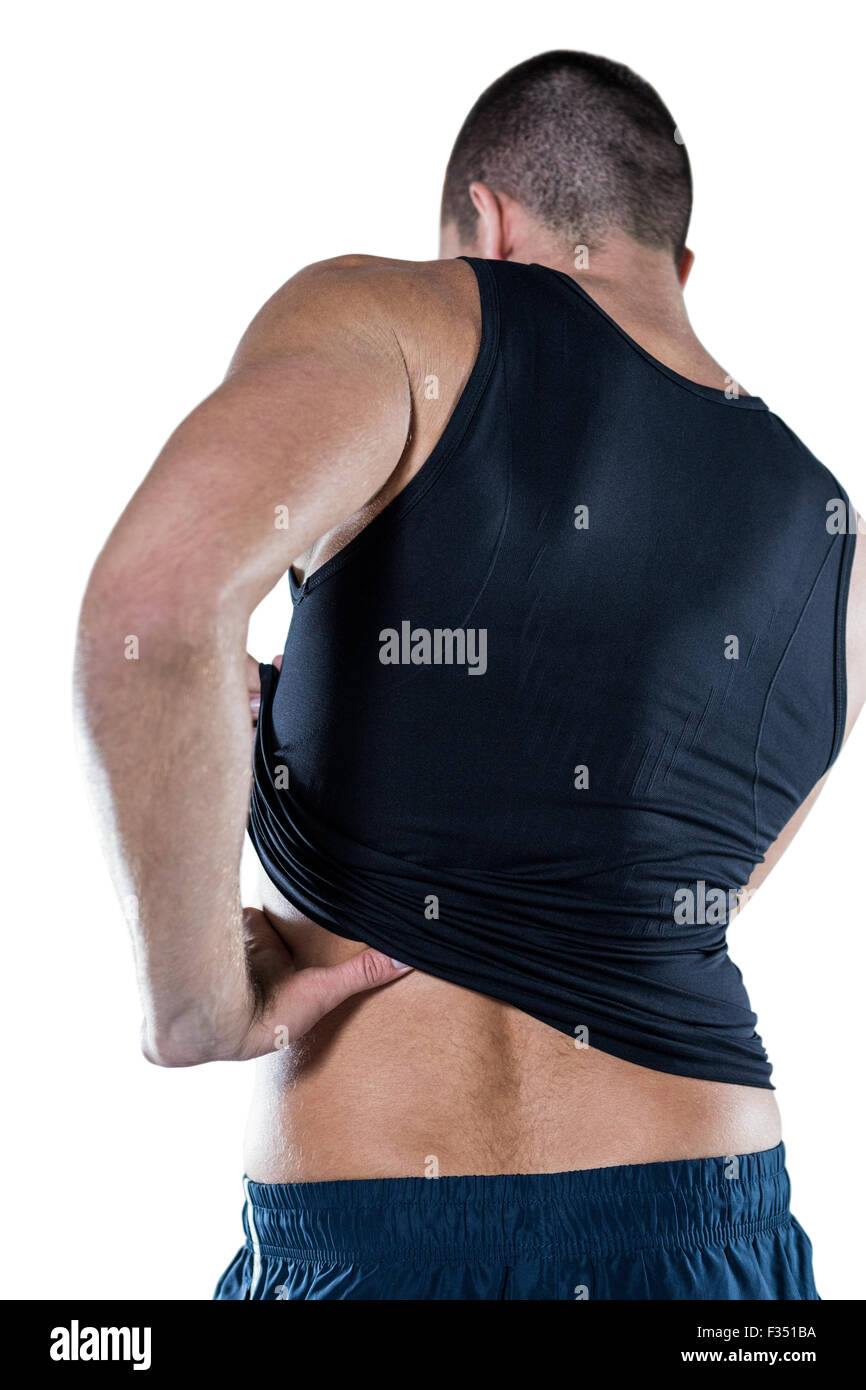 Rear view of man with back pain Stock Photo - Alamy