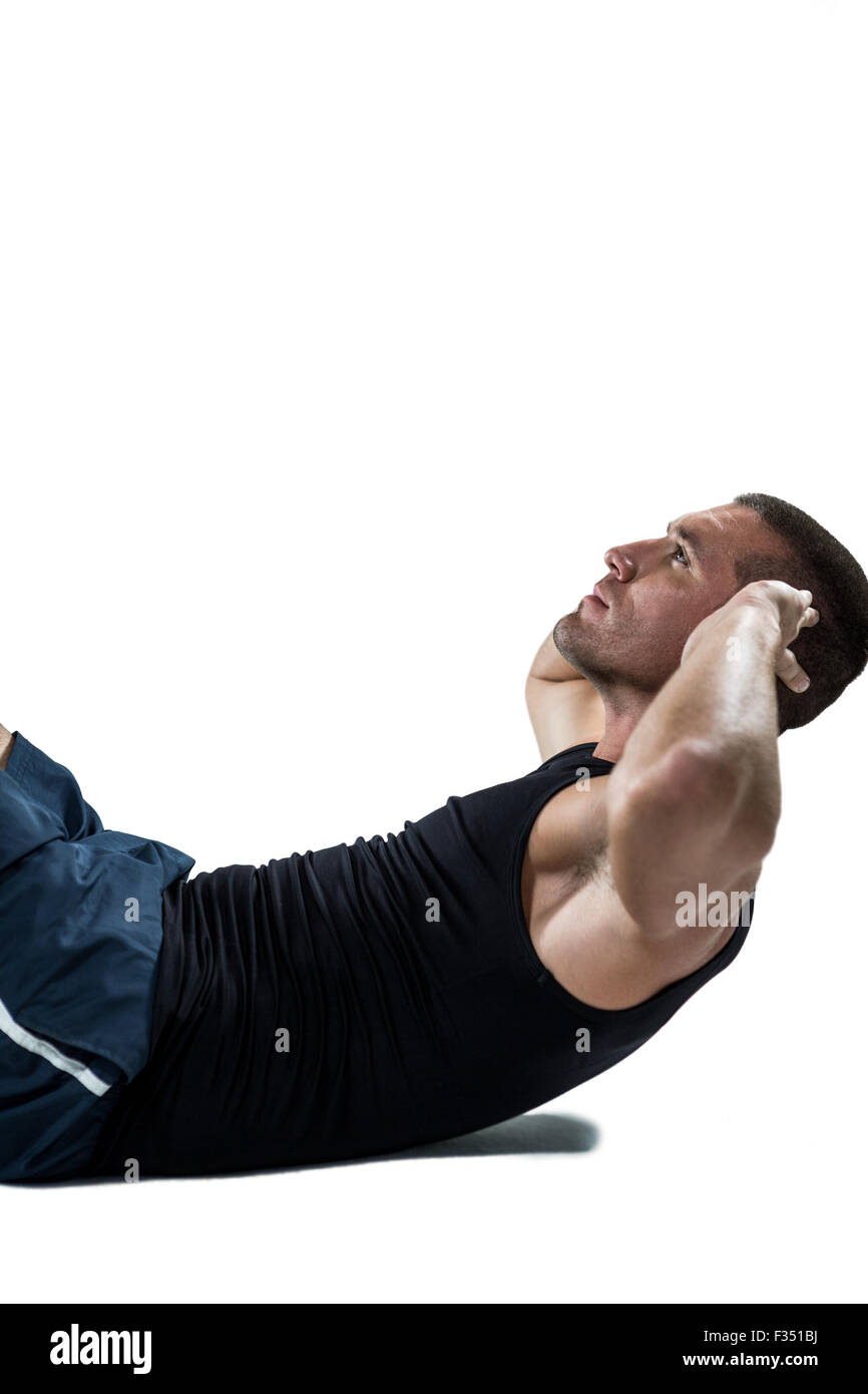 Confident athlete doing crunches Stock Photo - Alamy