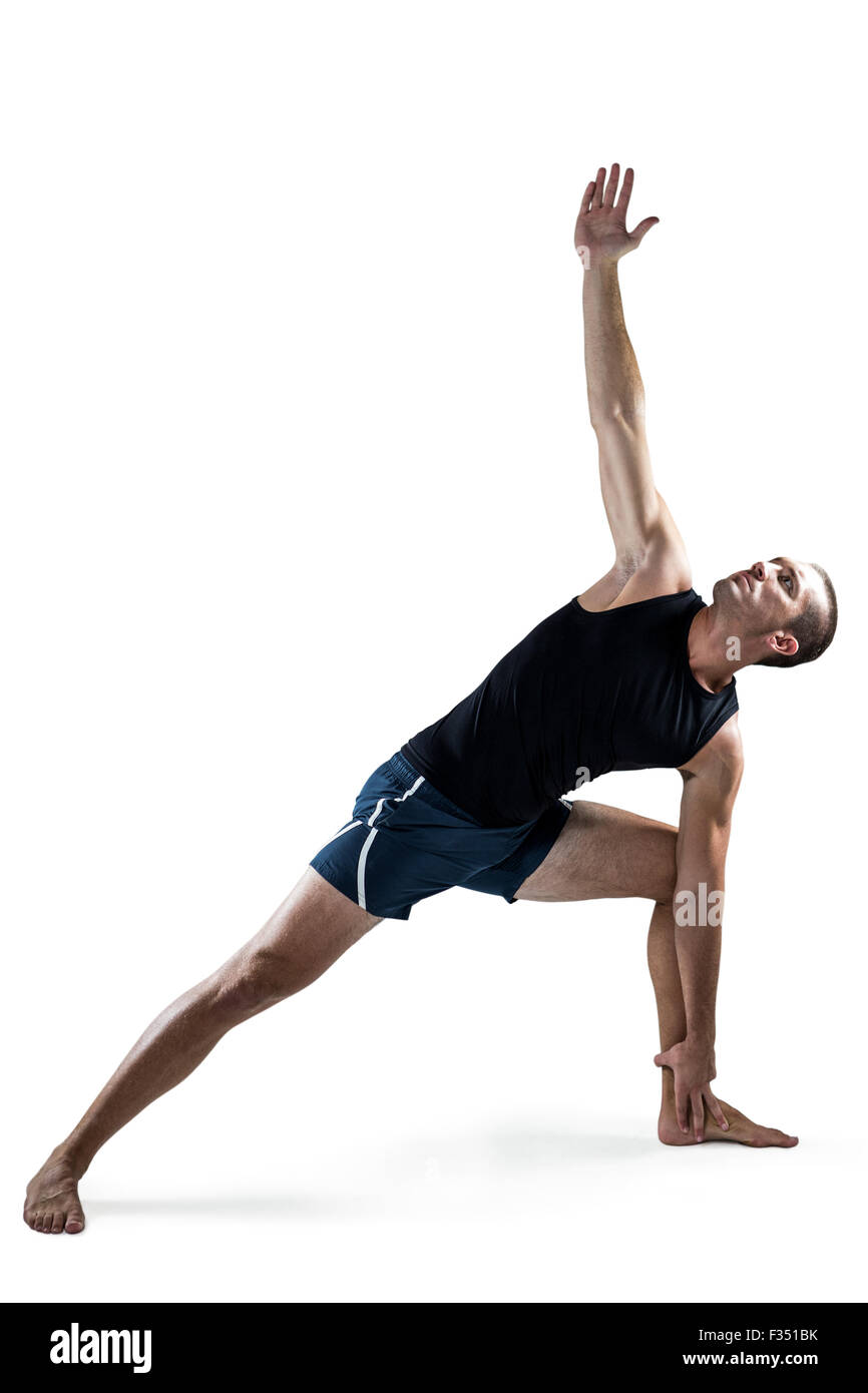 Full length of trainer stretching Stock Photo - Alamy