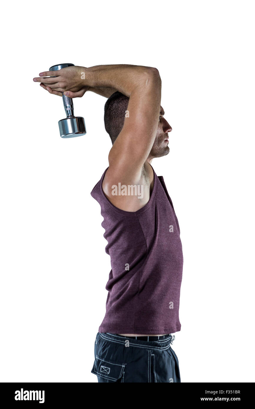 Profile view of athlete working out with dumbbells Stock Photo - Alamy