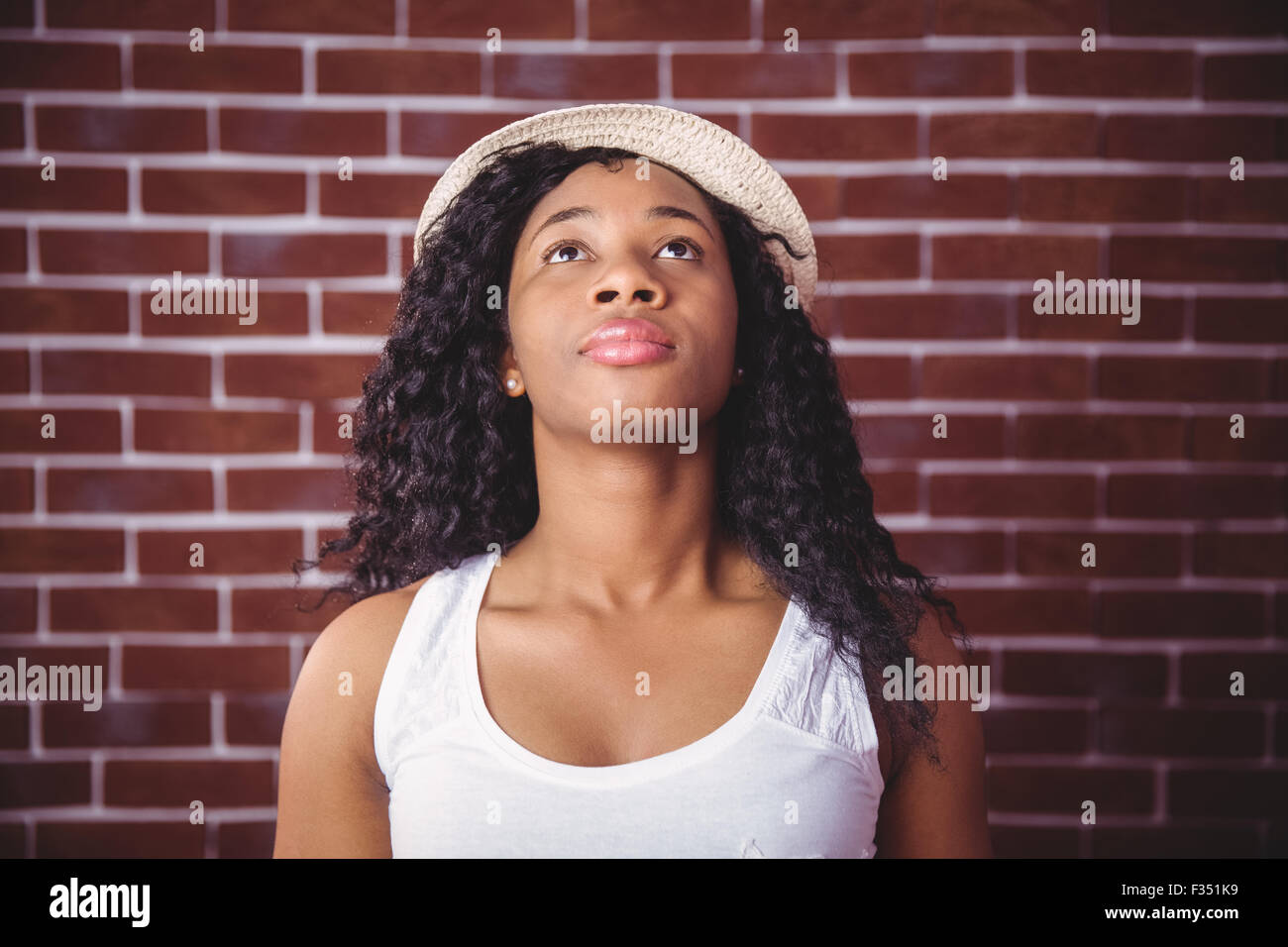 Young woman posing with hat Stock Photo - Alamy