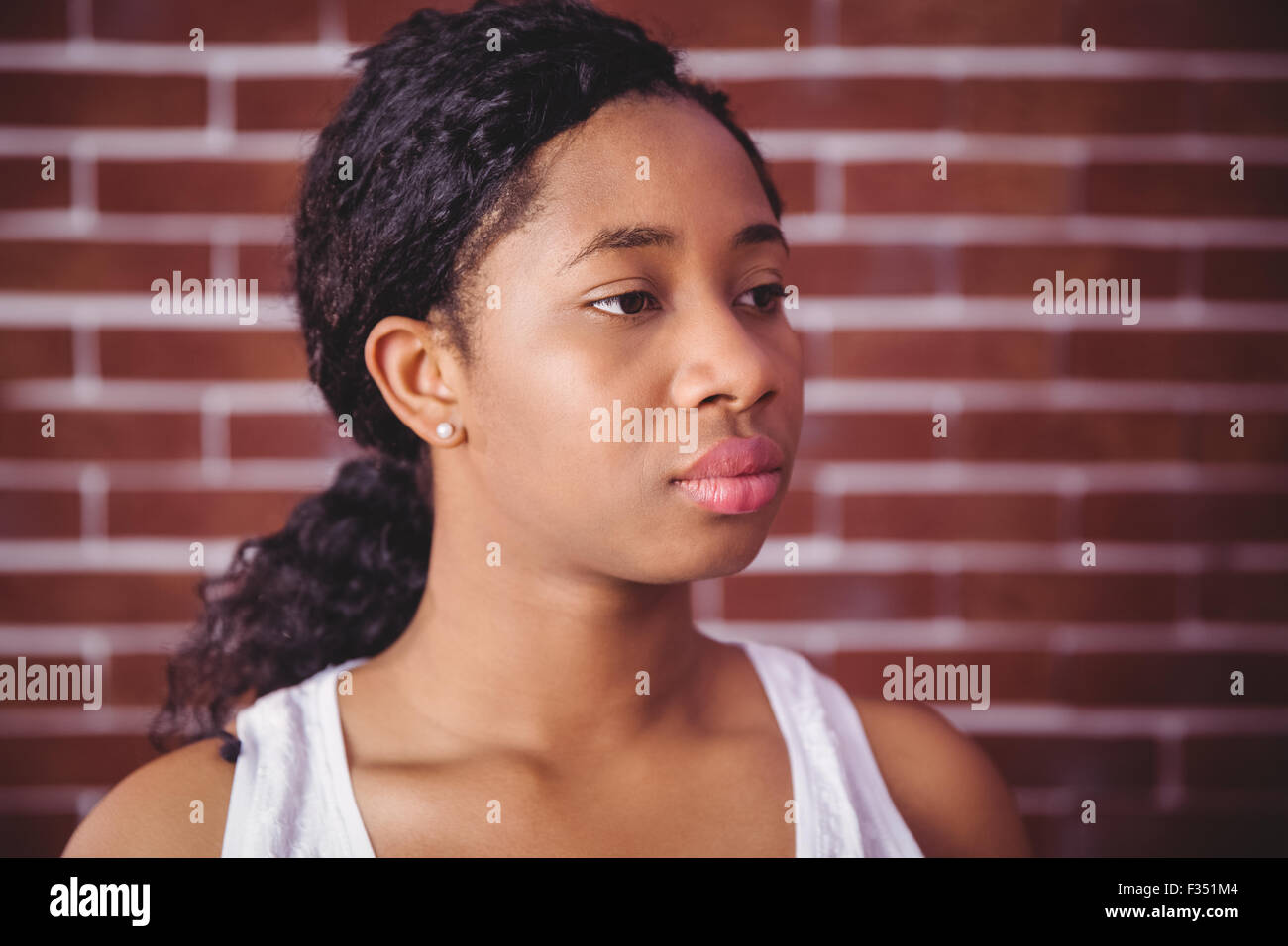Young woman looking to the side Stock Photo - Alamy