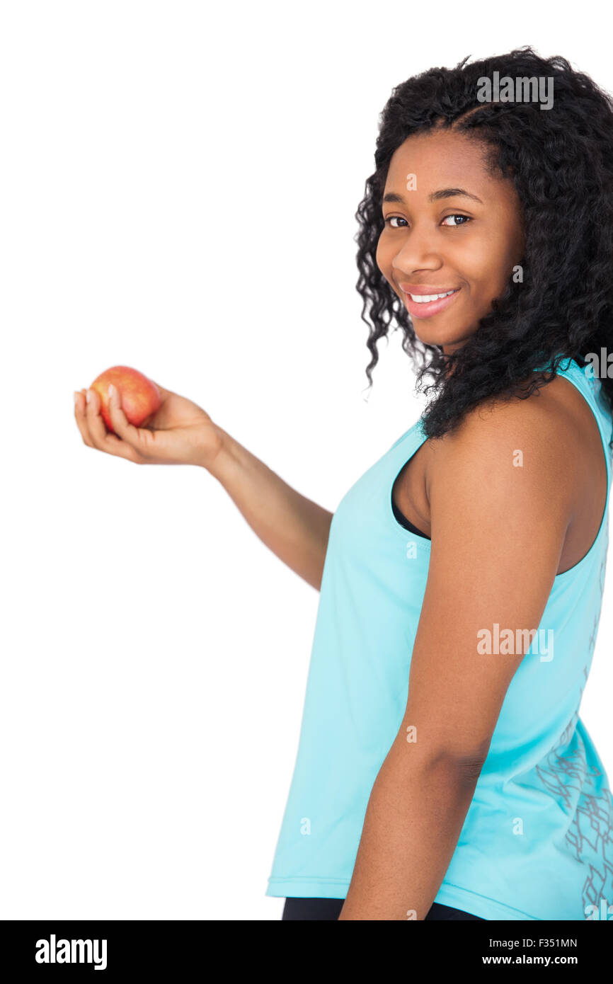 Model holding a red apple Stock Photo - Alamy