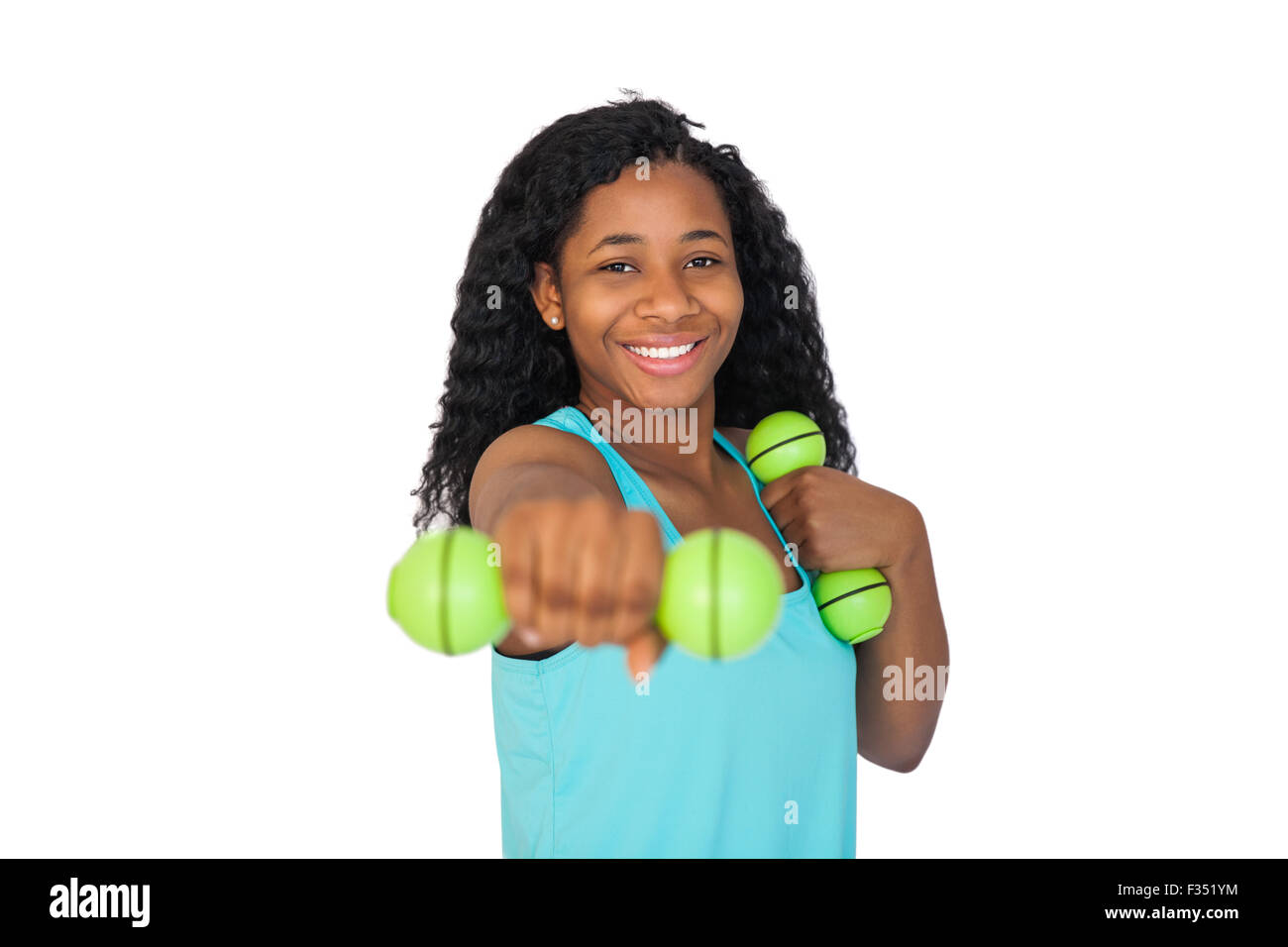 Woman exercising using dumbbells Stock Photo - Alamy