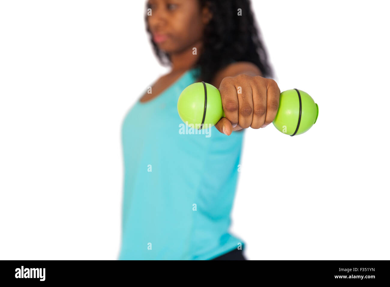 Woman exercising using dumbbells Stock Photo - Alamy