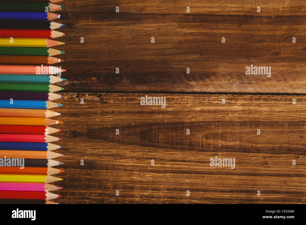 Colour pencils on table with copy space Stock Photo - Alamy