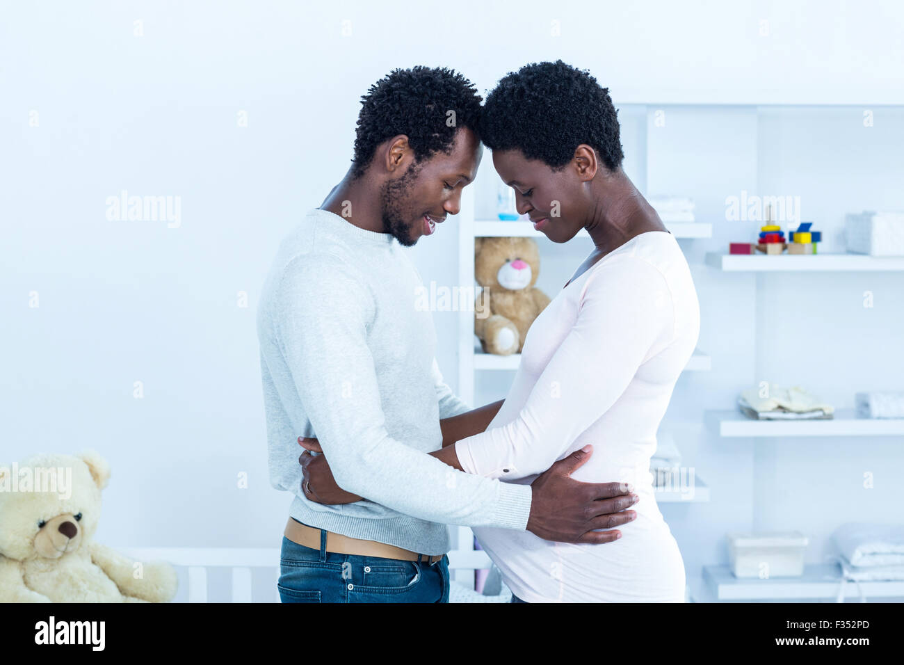 Husband embracing wife while touching heads Stock Photo - Alamy