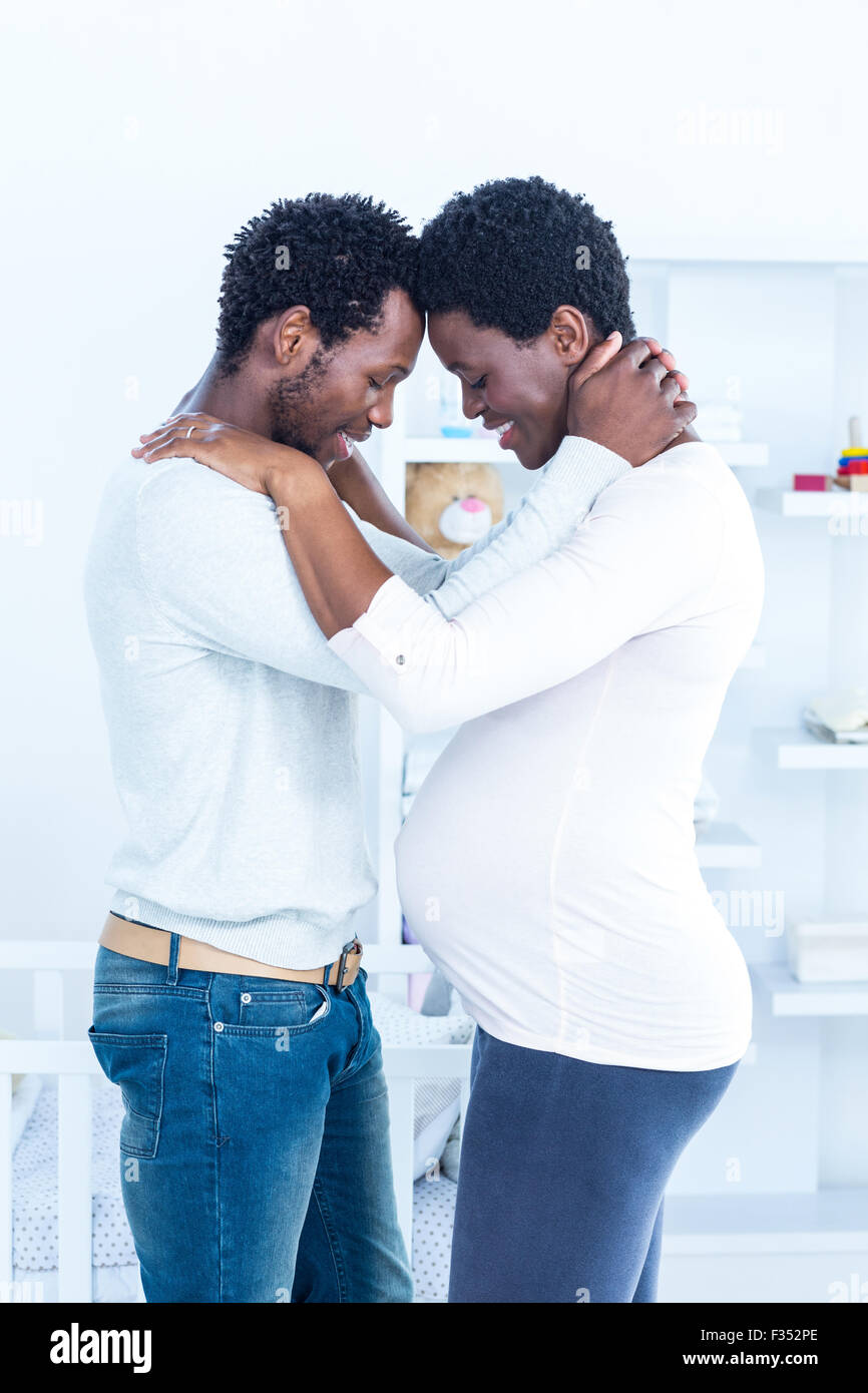 Couple embracing while touching heads Stock Photo - Alamy