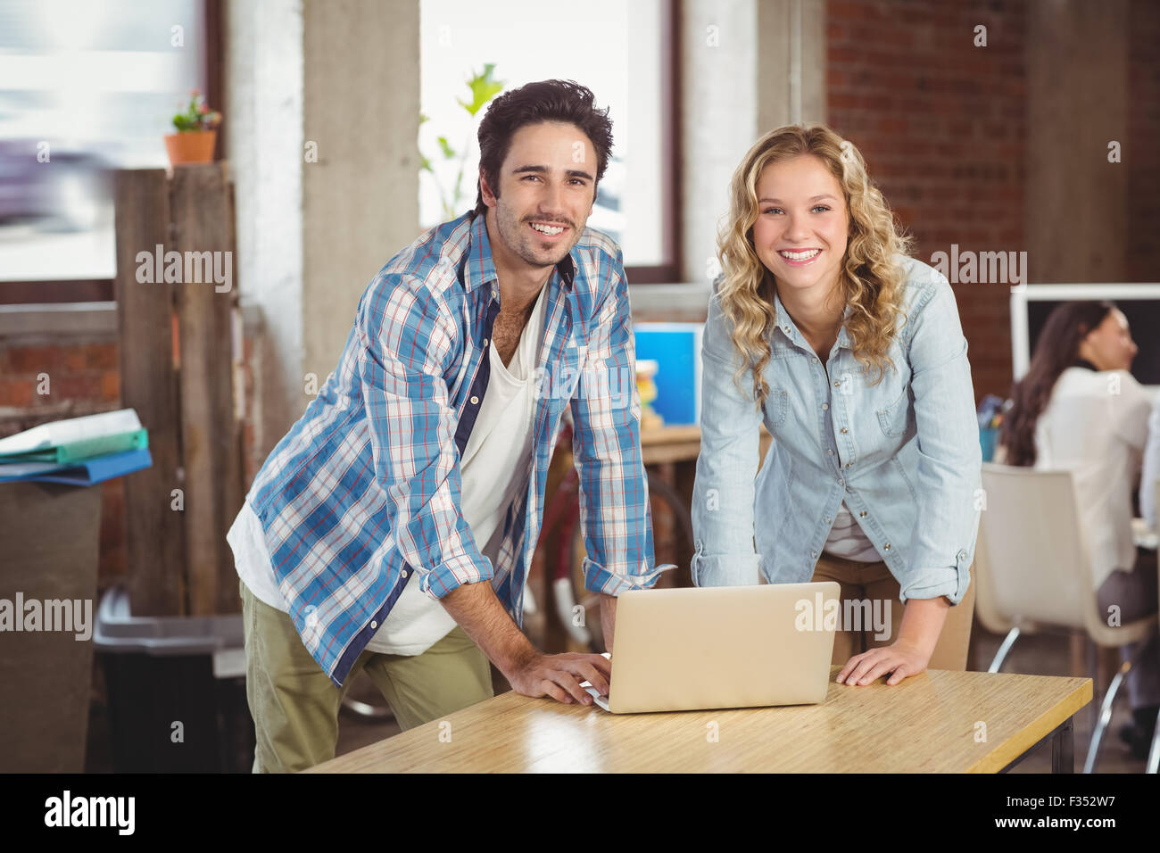 Portrait of colleagues at office Stock Photo - Alamy