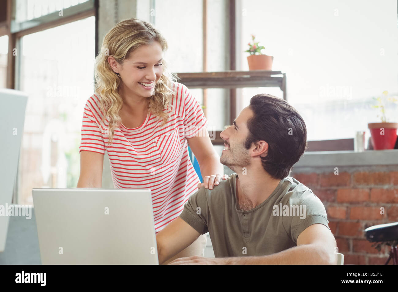 Happy business people discussing in office Stock Photo - Alamy