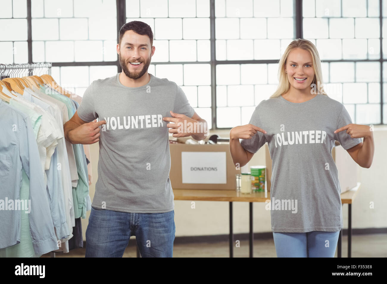 Portrait of volunteers showing volunteer text on tshirts Stock Photo ...