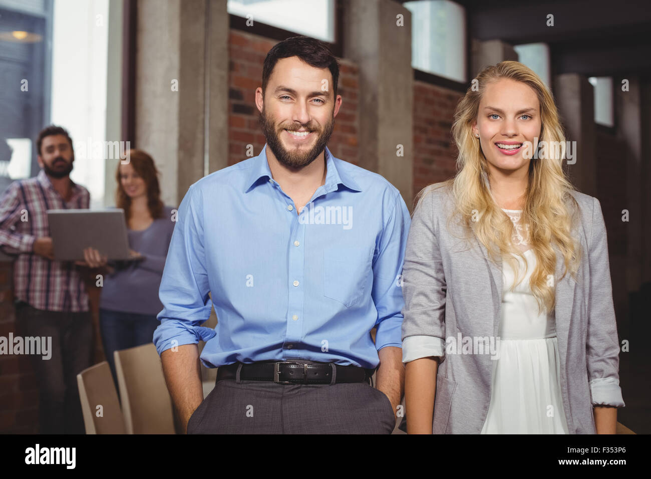 Portrait of smiling business colleagues Stock Photo - Alamy