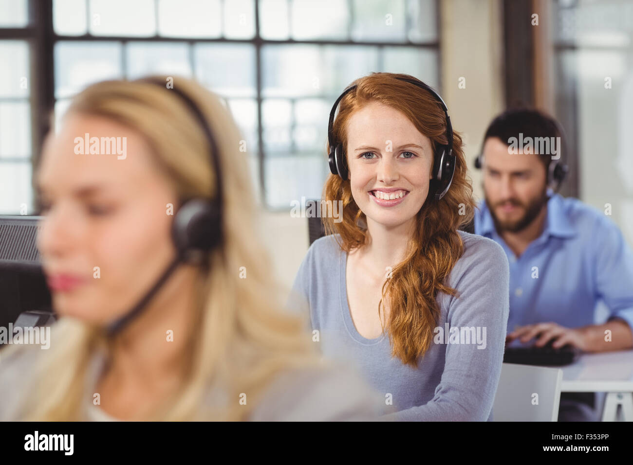 Portrait of smiling female operator Stock Photo - Alamy