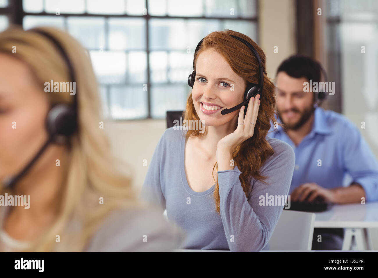 Portrait of happy operator Stock Photo - Alamy