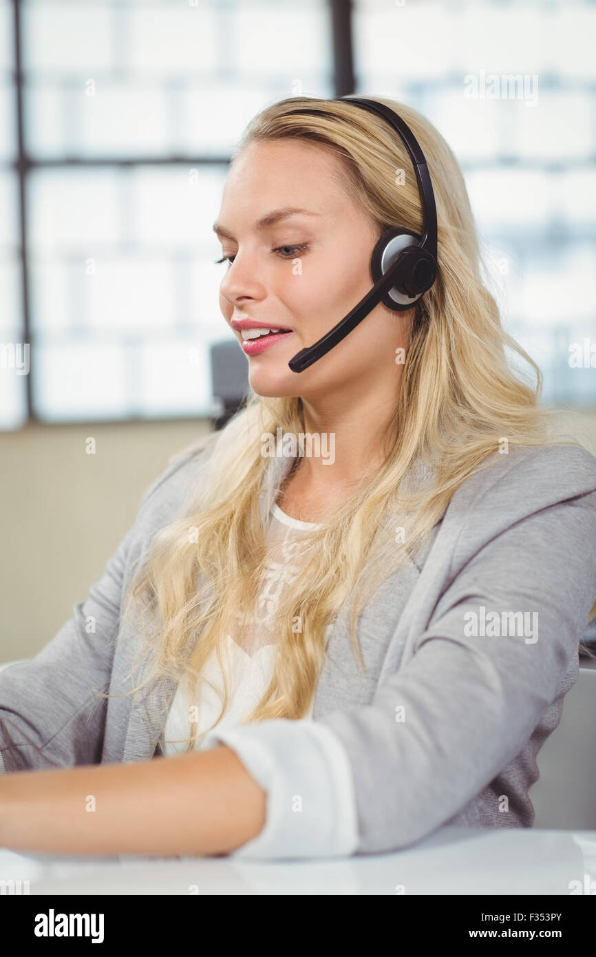 Cheerful operator working in office Stock Photo - Alamy