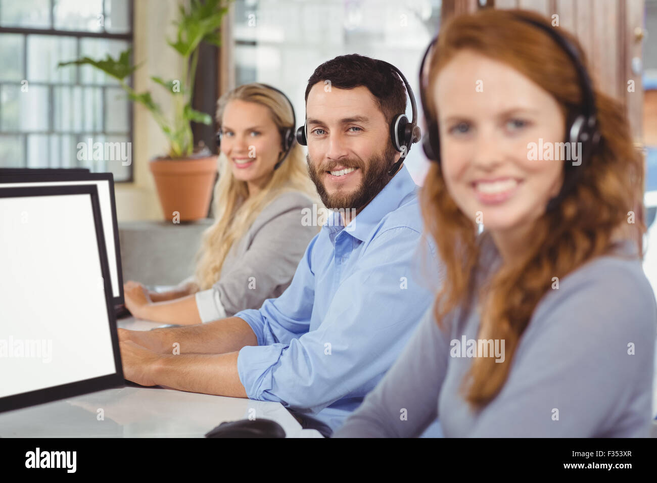 Portrait of smiling operators Stock Photo - Alamy