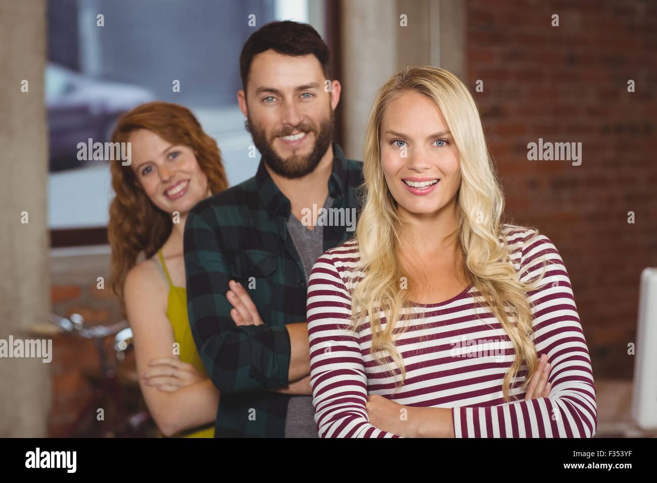 Portrait of confident smiling business people standing Stock Photo - Alamy