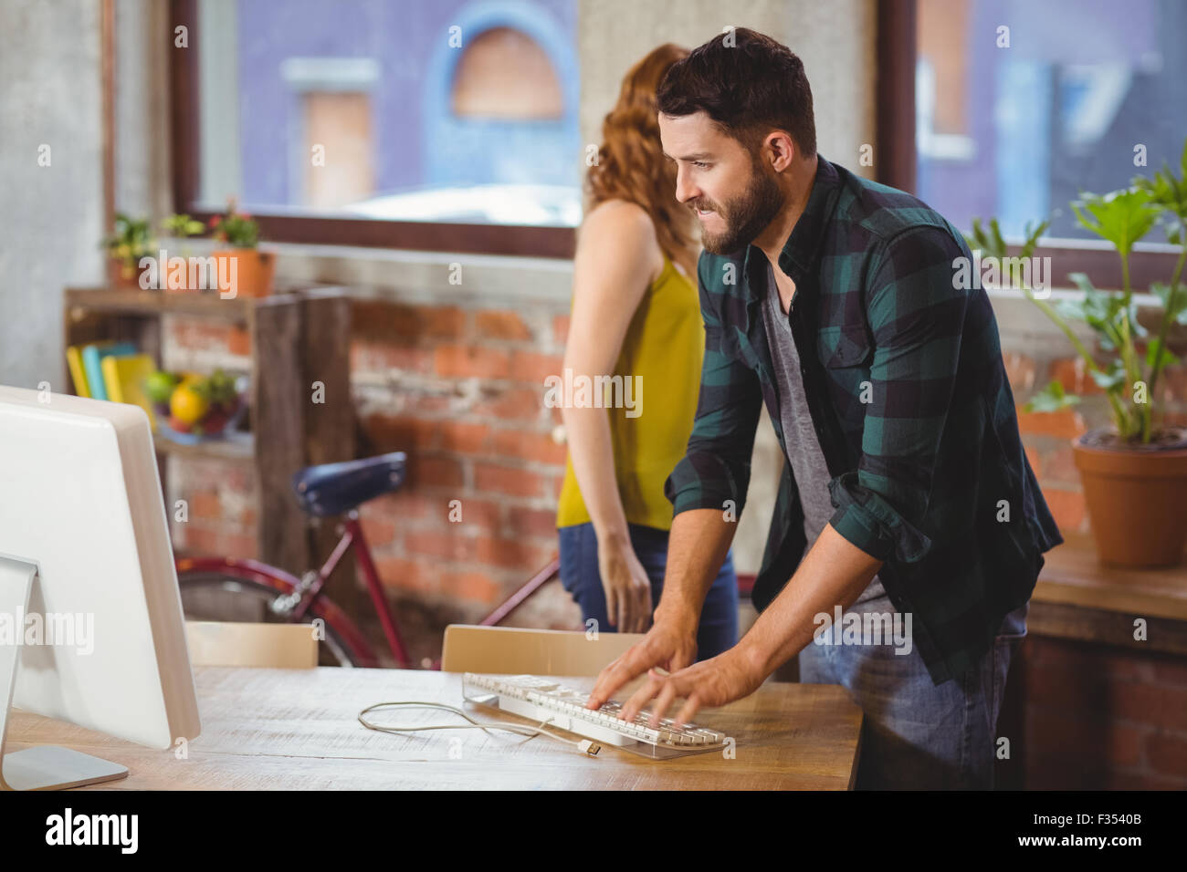 Man working on computer Stock Photo - Alamy