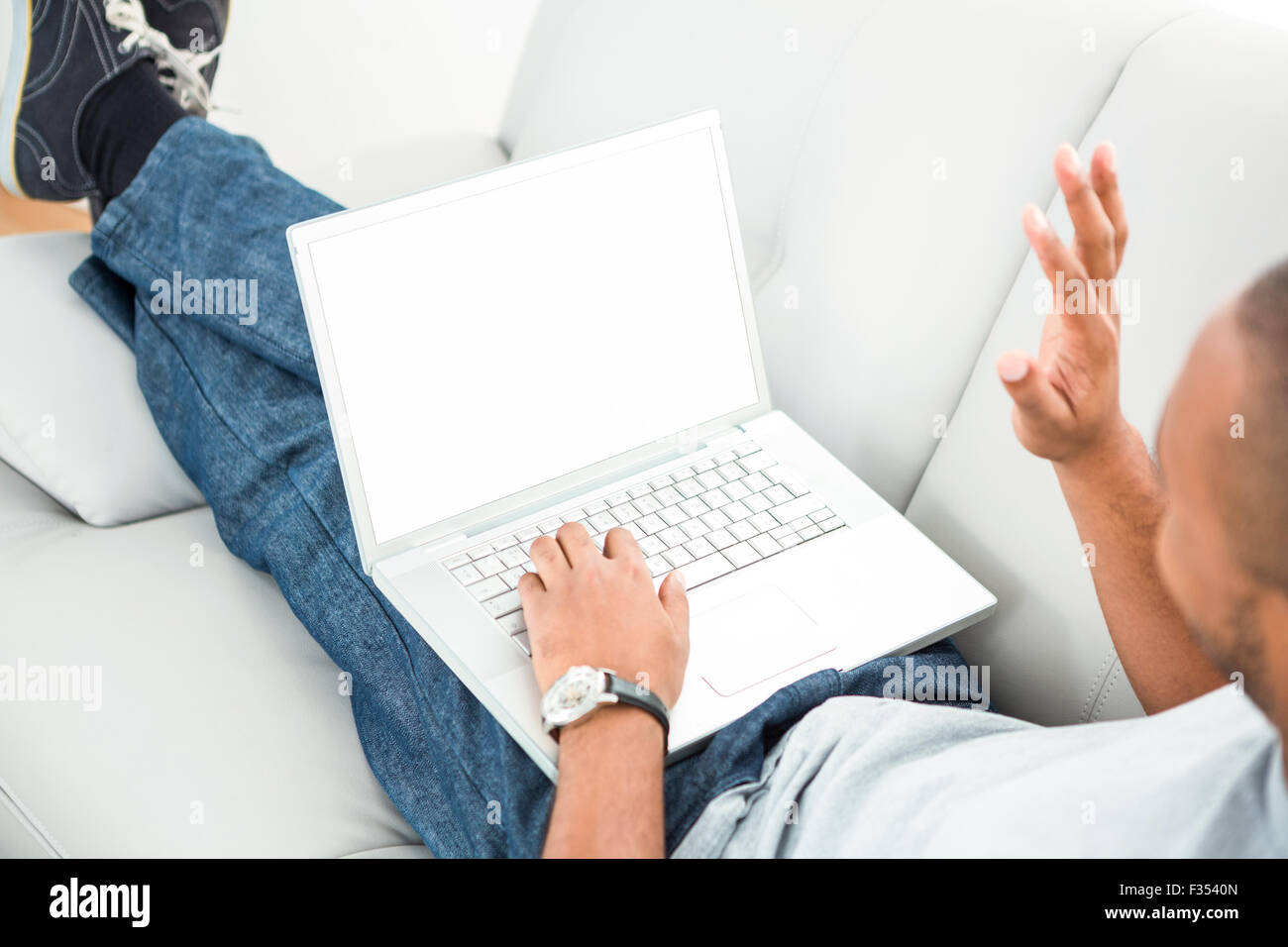 Happy man video chatting Stock Photo - Alamy