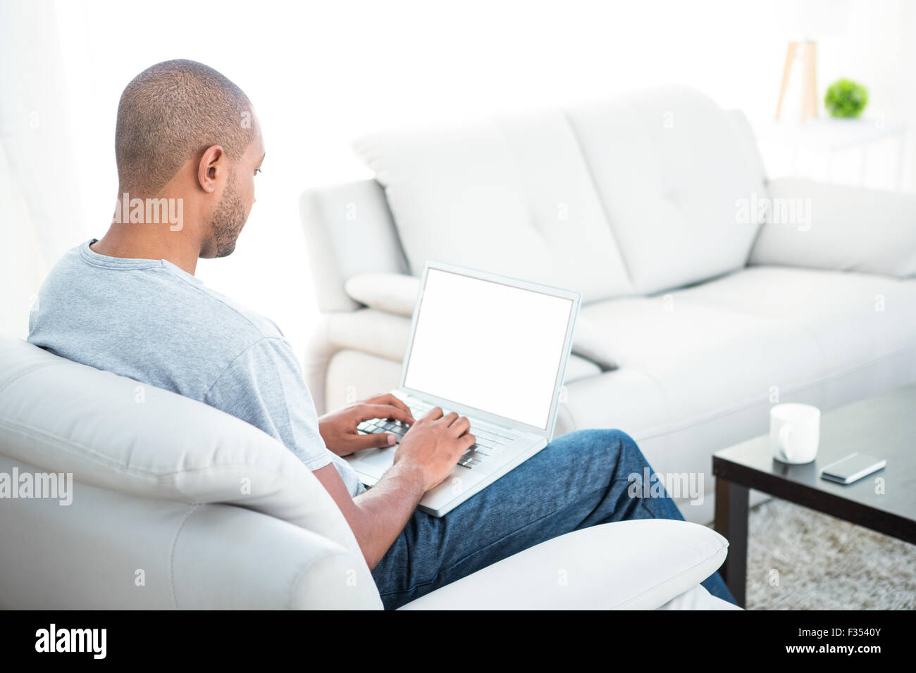 Young man blank laptop hi-res stock photography and images - Alamy