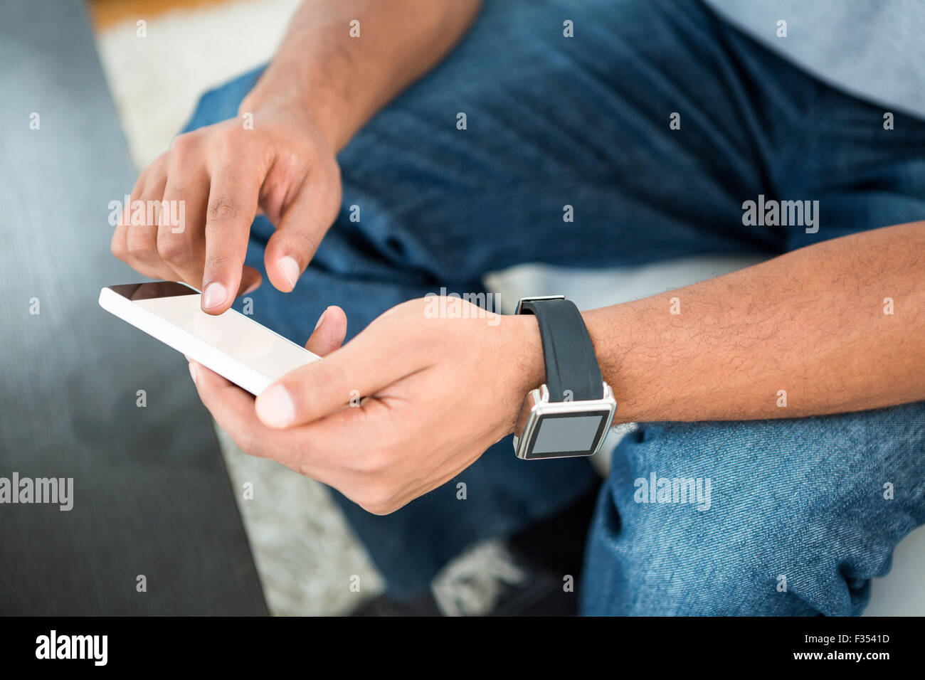 Close-up of man scrolling on phone Stock Photo - Alamy