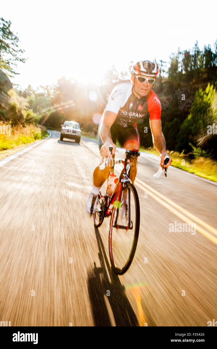 Road Cyclist rides his bike Stock Photo - Alamy