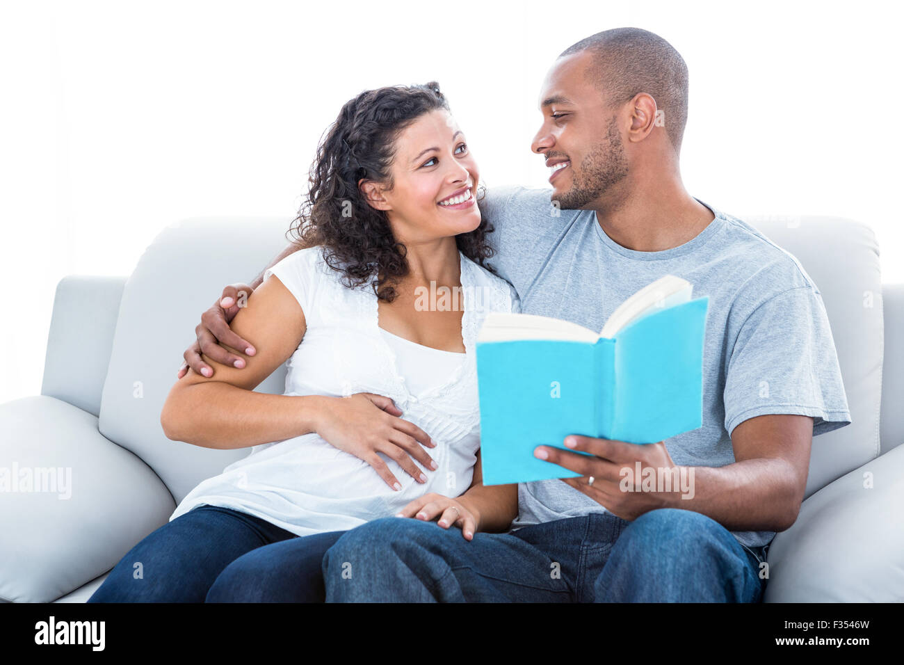 A happy Couple reading a book Stock Photo - Alamy