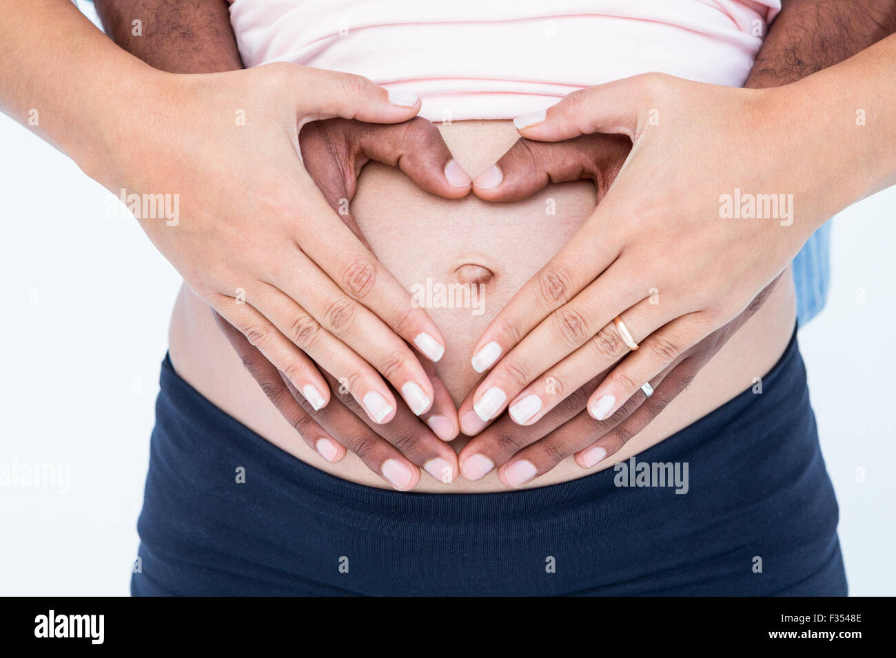 Pregnant belly hands heart hi-res stock photography and images - Alamy