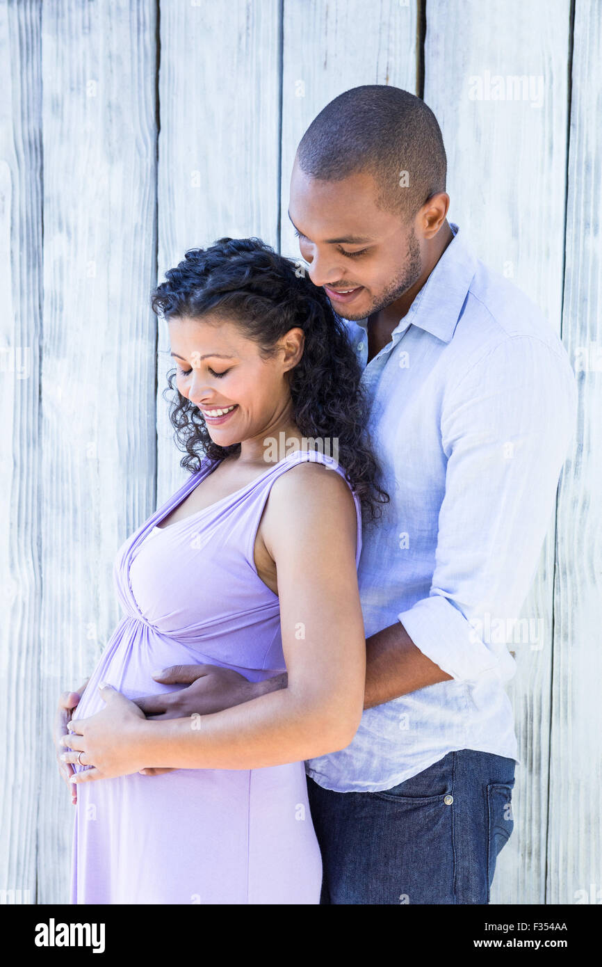 Happy pregnant couple touching belly Stock Photo - Alamy