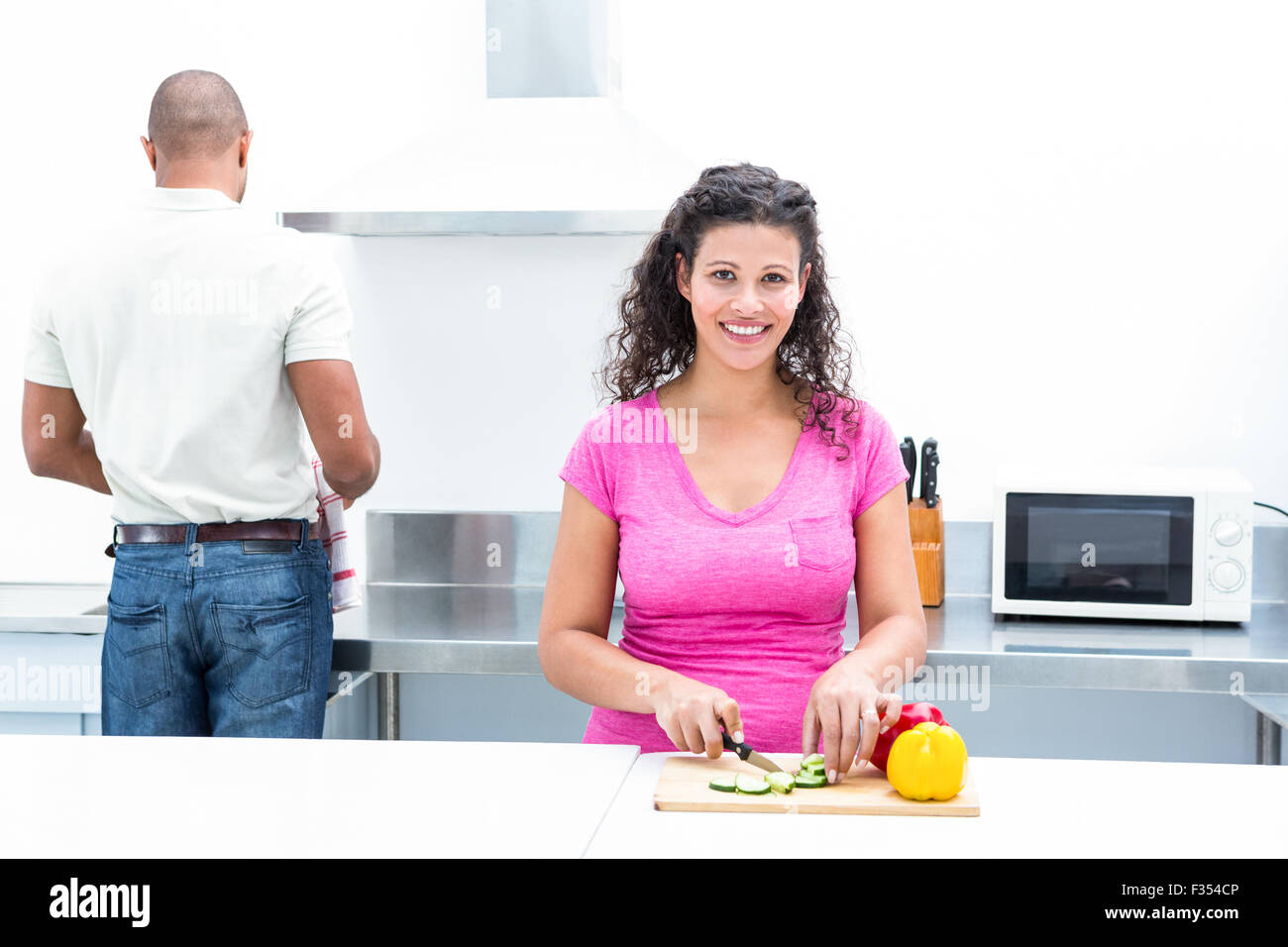 Pregnant couple chopping vegetables hi-res stock photography and images ...