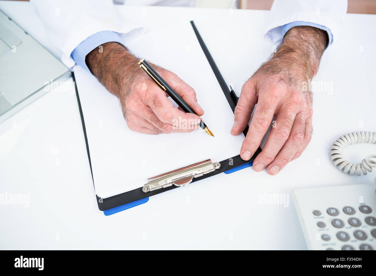Doctor writing on paper hi-res stock photography and images - Alamy