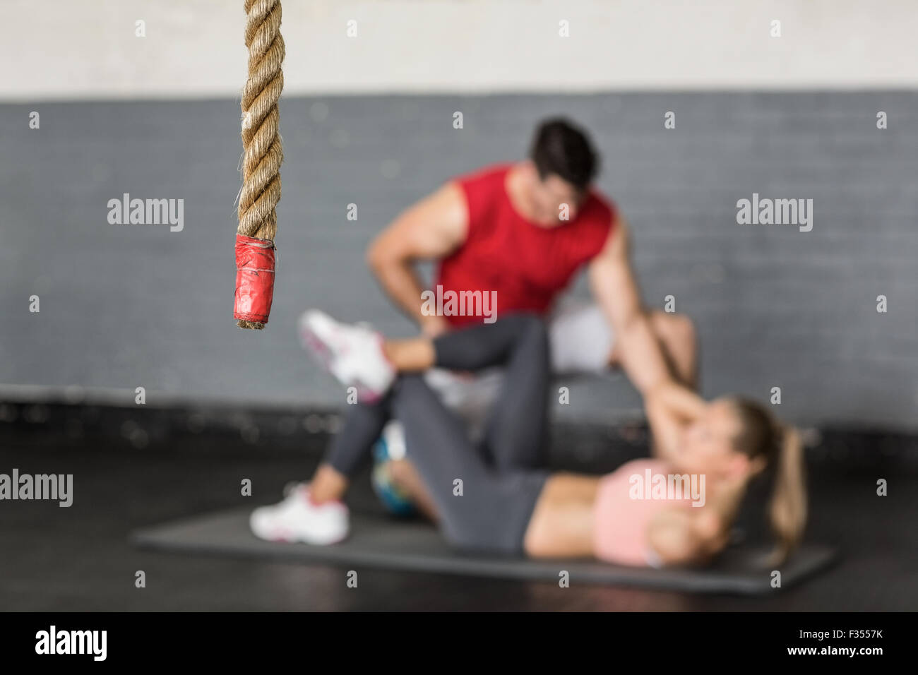 Muscular couple doing abdominal exercises Stock Photo - Alamy