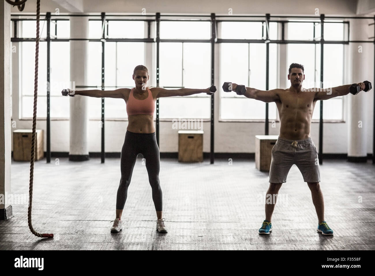 Two fit people doing fitness Stock Photo - Alamy