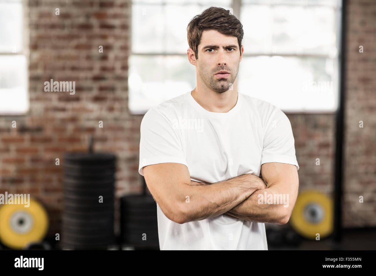 Portrait of muscular man looking at camera Stock Photo - Alamy