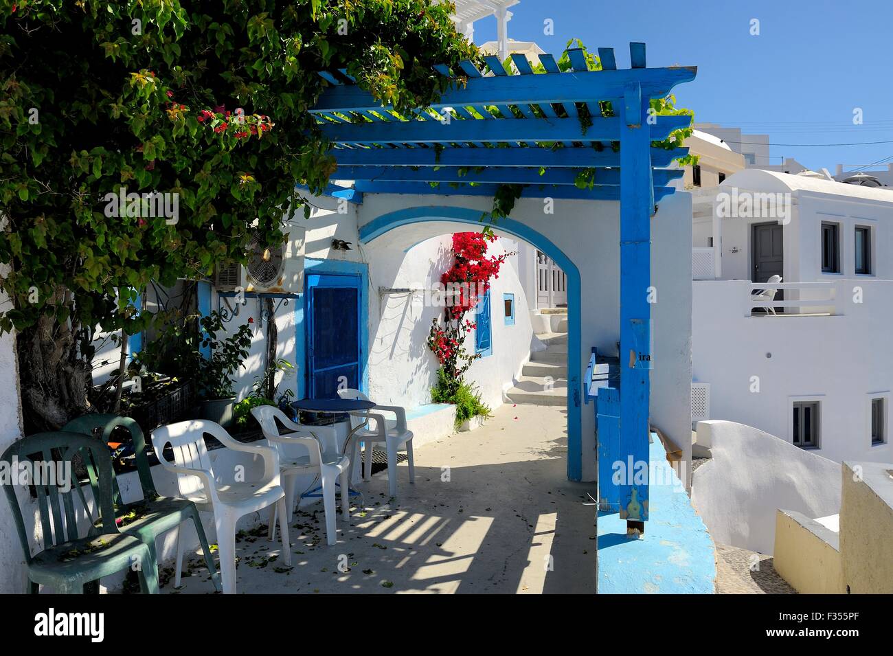 Pathway steps up to holiday accommodation on the island of Santorini ...