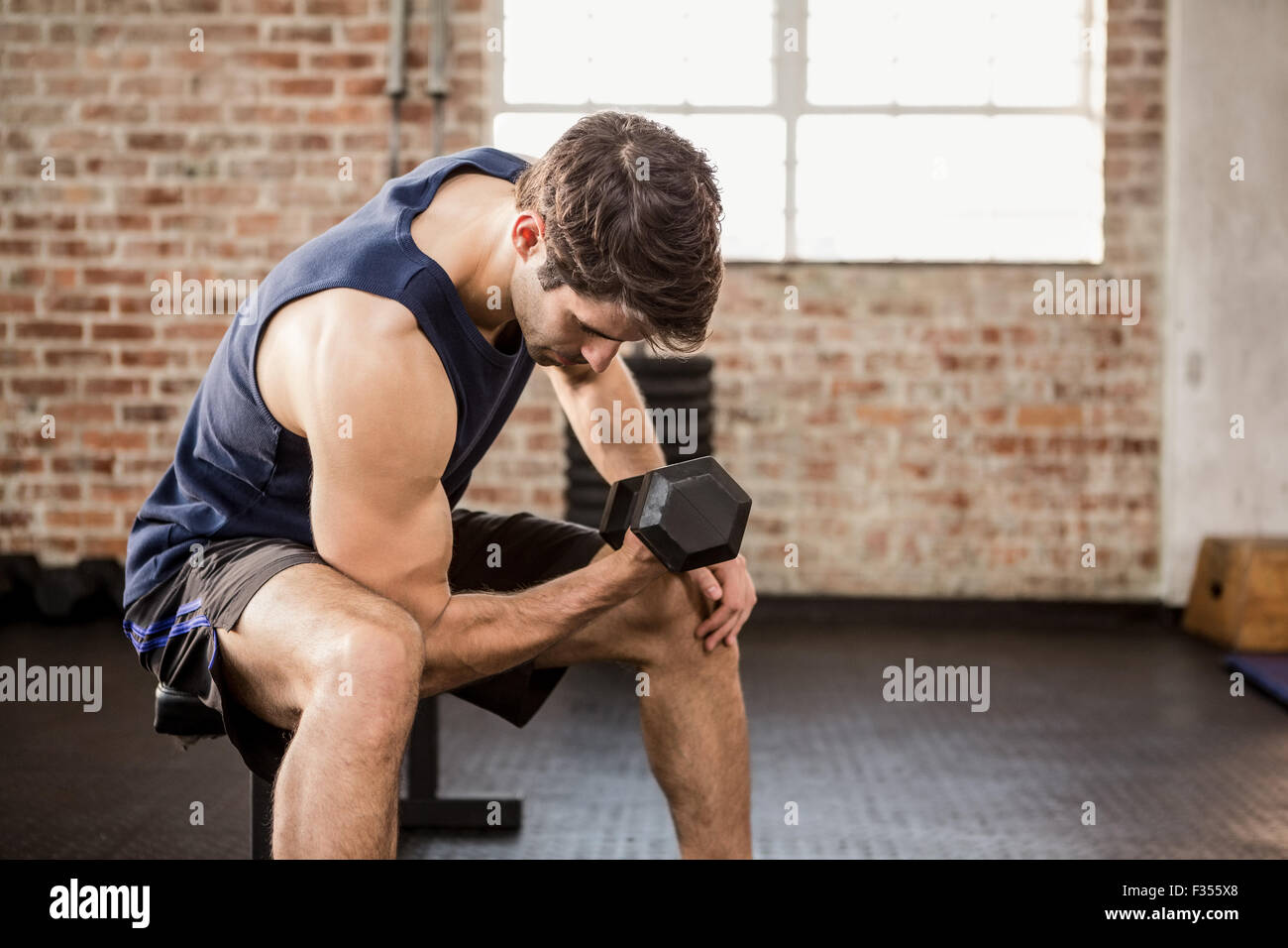 Man lifting heavy dumbbell crossfit hi-res stock photography and images ...