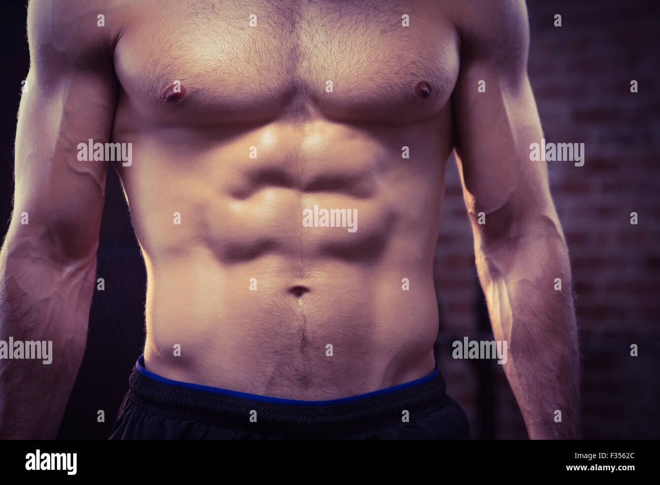 Midsection of muscular man showing his body Stock Photo - Alamy