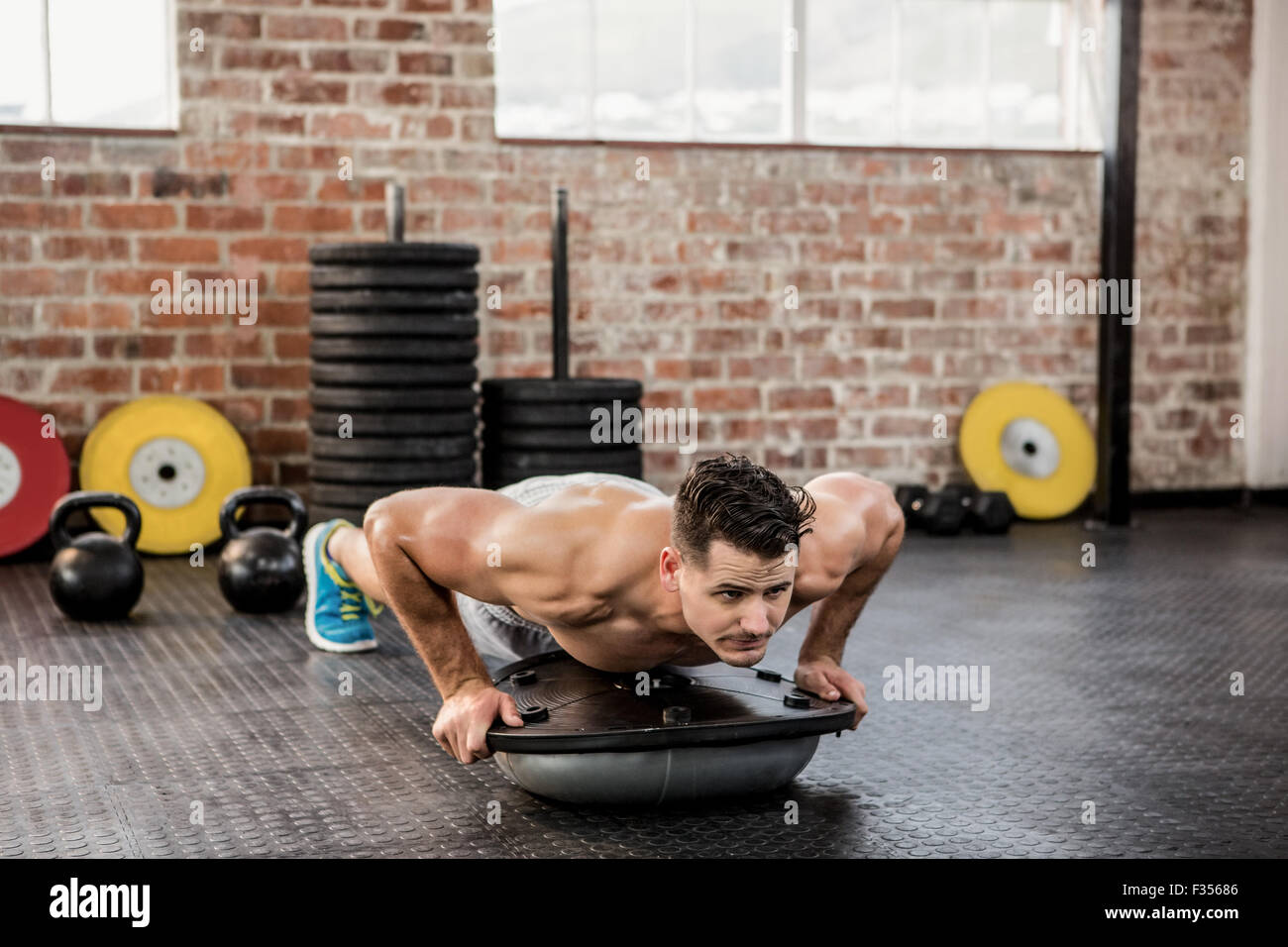 Shirtless man doing bosu push ups Stock Photo - Alamy