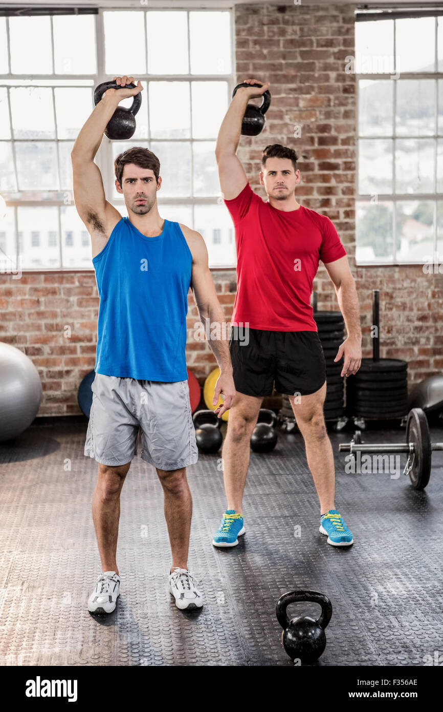 Muscular men lifting kettlebell hi-res stock photography and images - Alamy