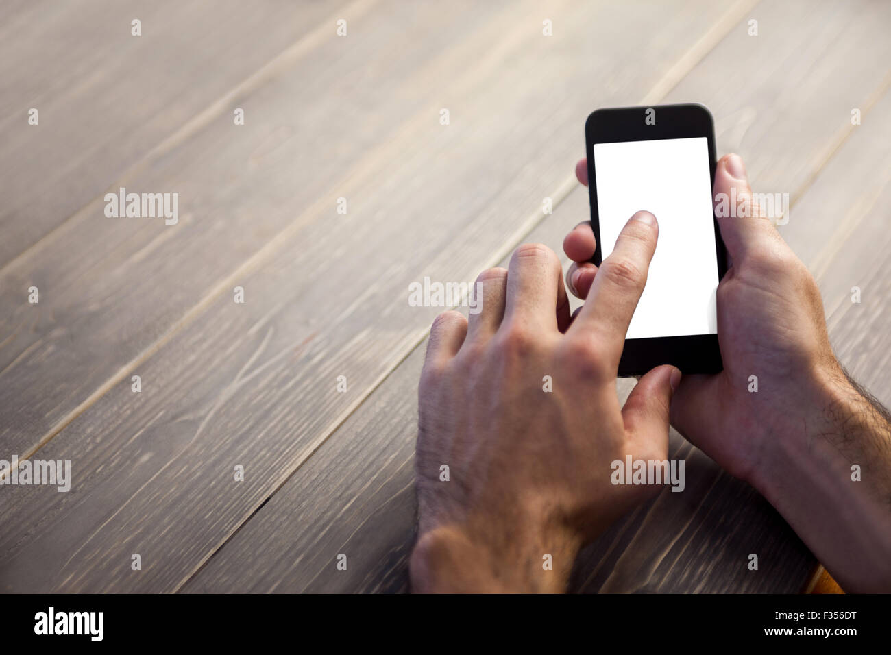 Cropped image of person using smartphone Stock Photo - Alamy