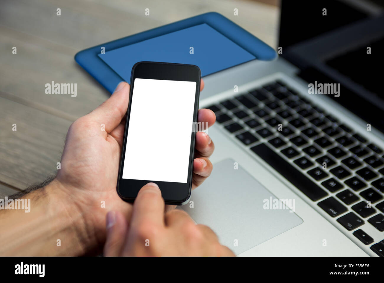 Cropped image of person using mobile phone Stock Photo - Alamy