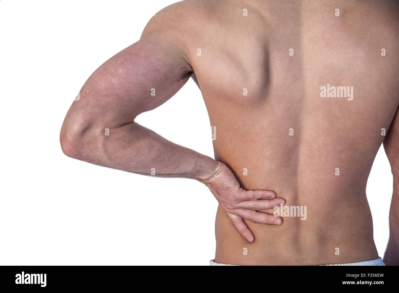 Midsection of a man undergoing back pain Stock Photo - Alamy