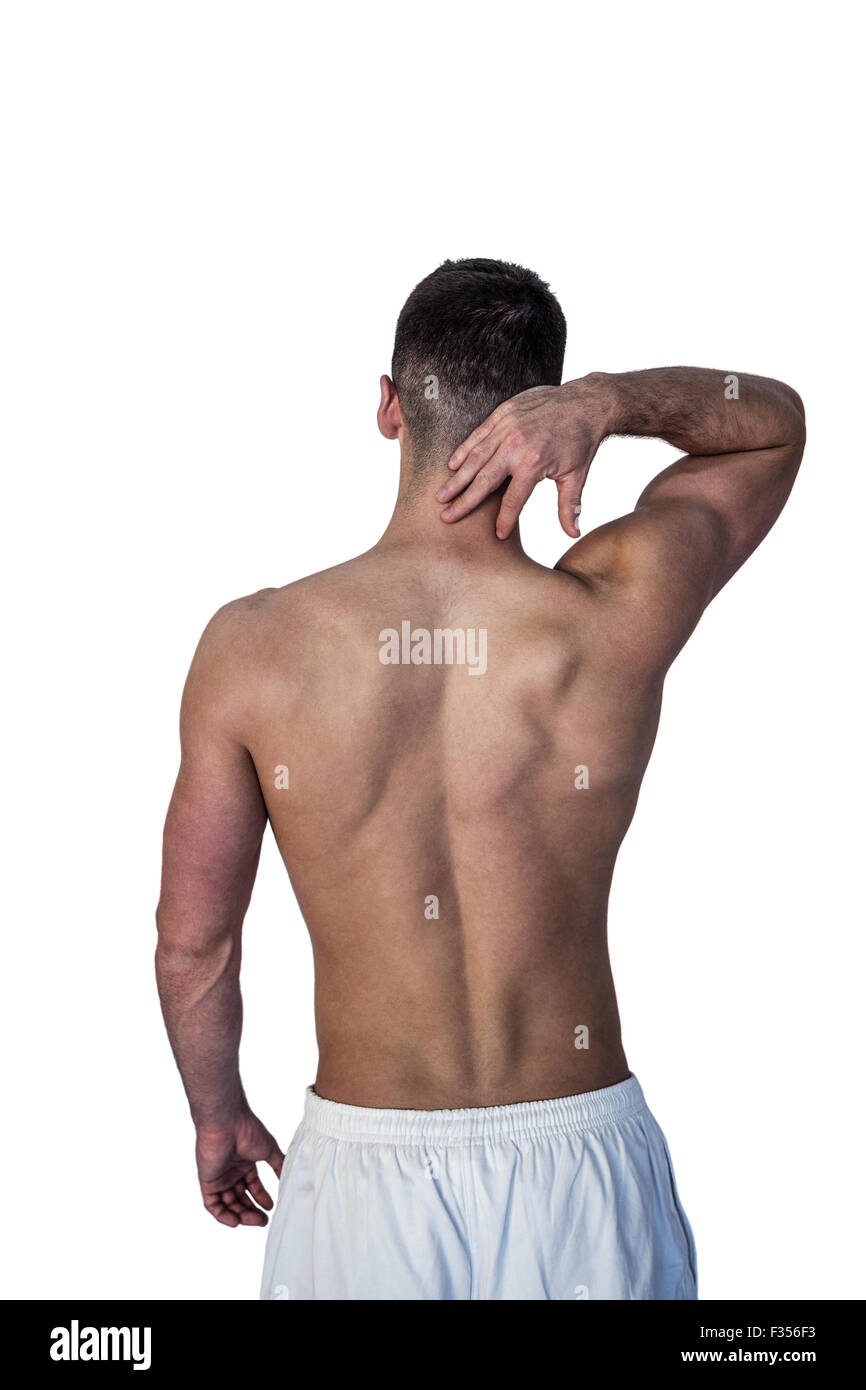 Rear view of a man suffering from neck pain Stock Photo - Alamy