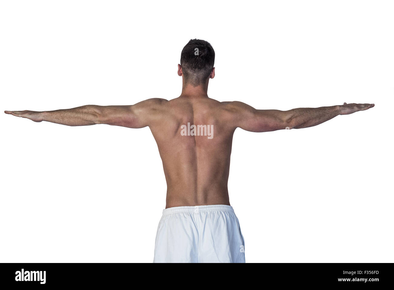 Rear view of a man stretching his arms Stock Photo - Alamy