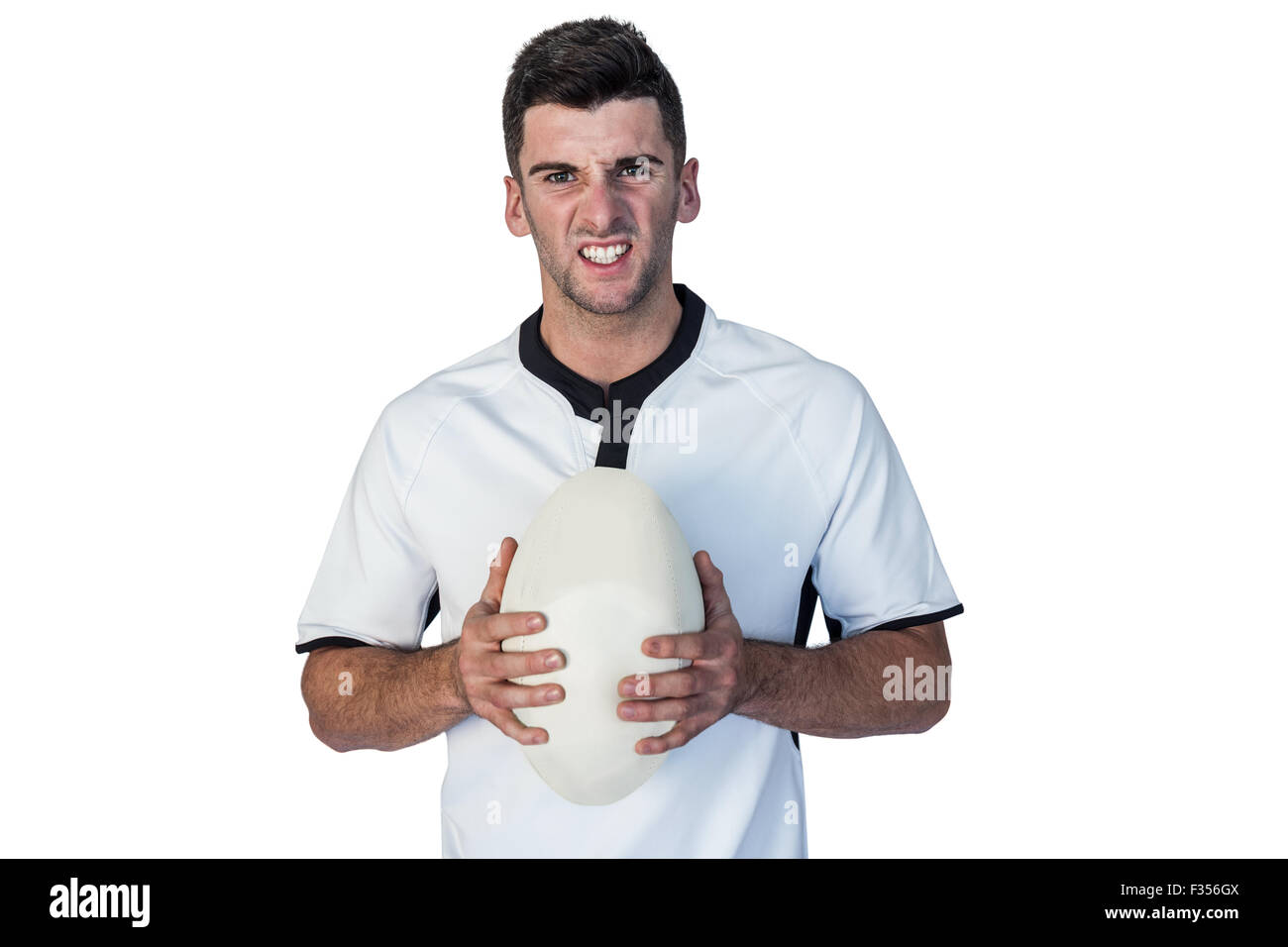 Portrait of an angry rugby player holding ball Stock Photo - Alamy