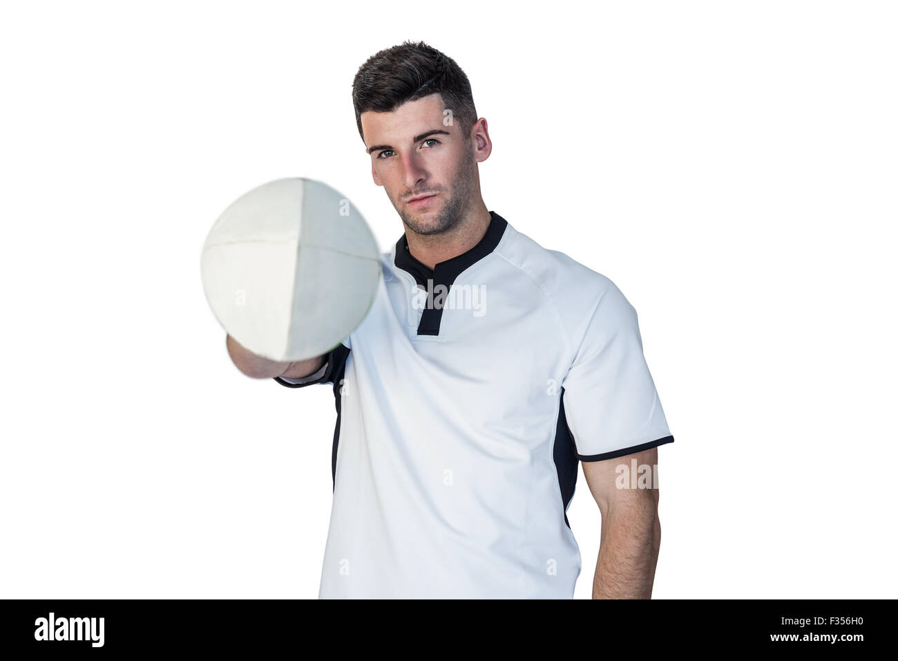 Portrait of rugby player holding the ball with one hand Stock Photo - Alamy