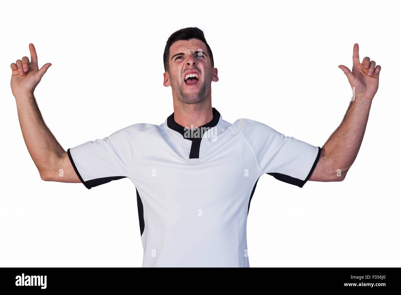 Excited rugby player pointing up Stock Photo - Alamy