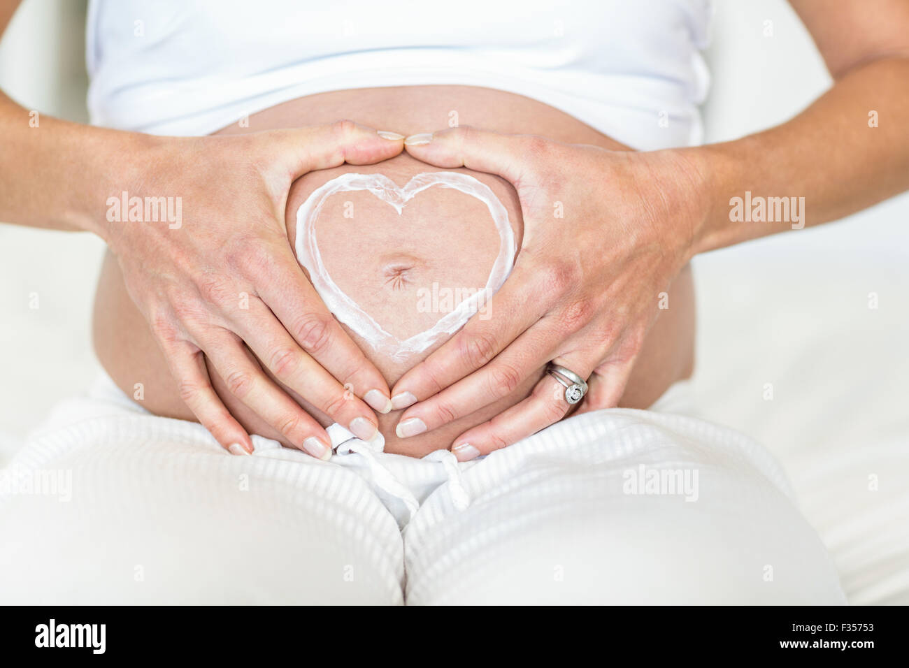 Pregnant belly rubbing midsection hi-res stock photography and images ...